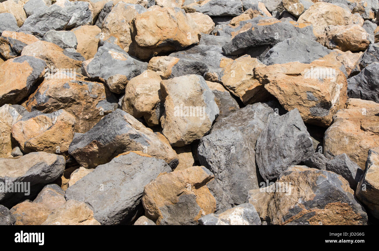 Large rock broken up to make a wall Stock Photo - Alamy