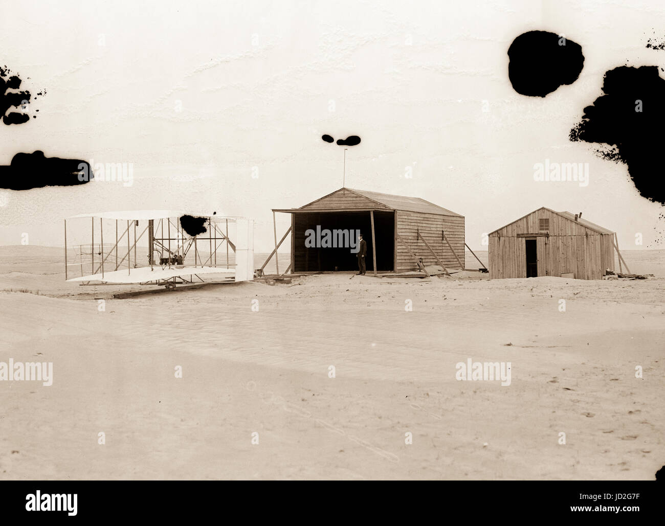 1903 machine and large camp building where it was housed, and smaller ...