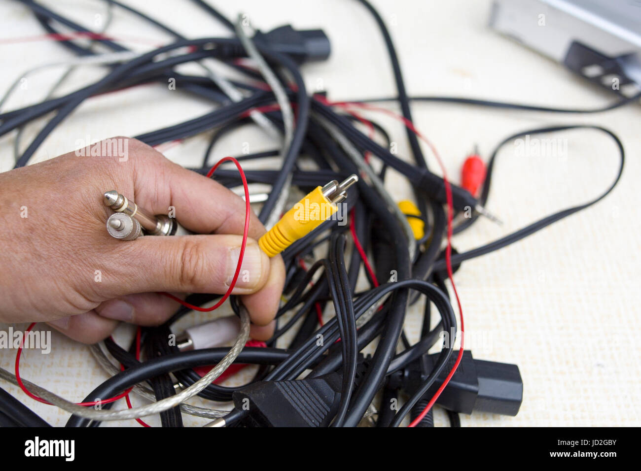 Various cables and connectors in messy condition and a master hand ...
