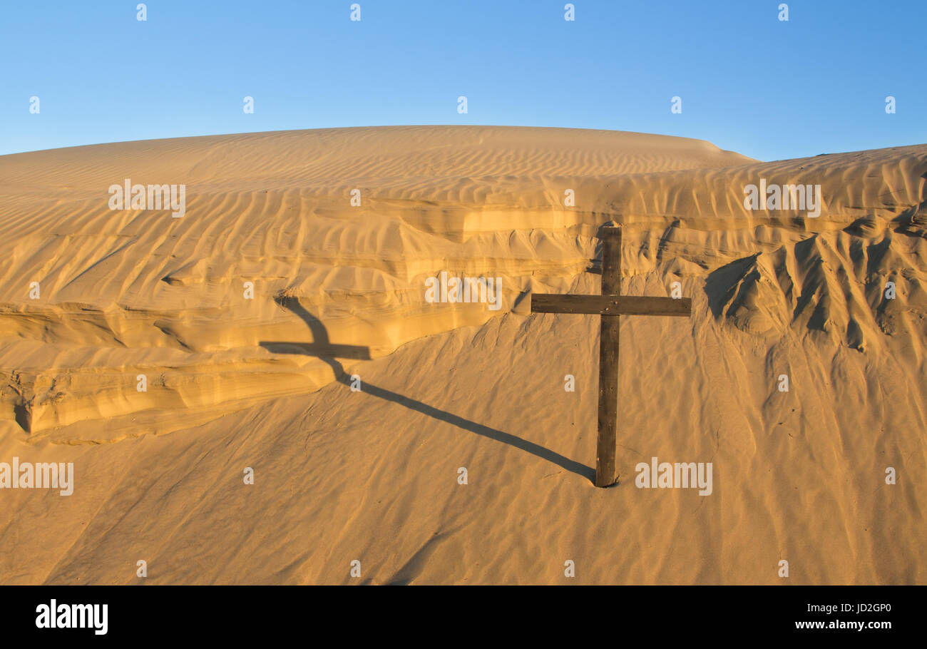 Cross in a golden sand dune bank, with a shadow Stock Photo - Alamy