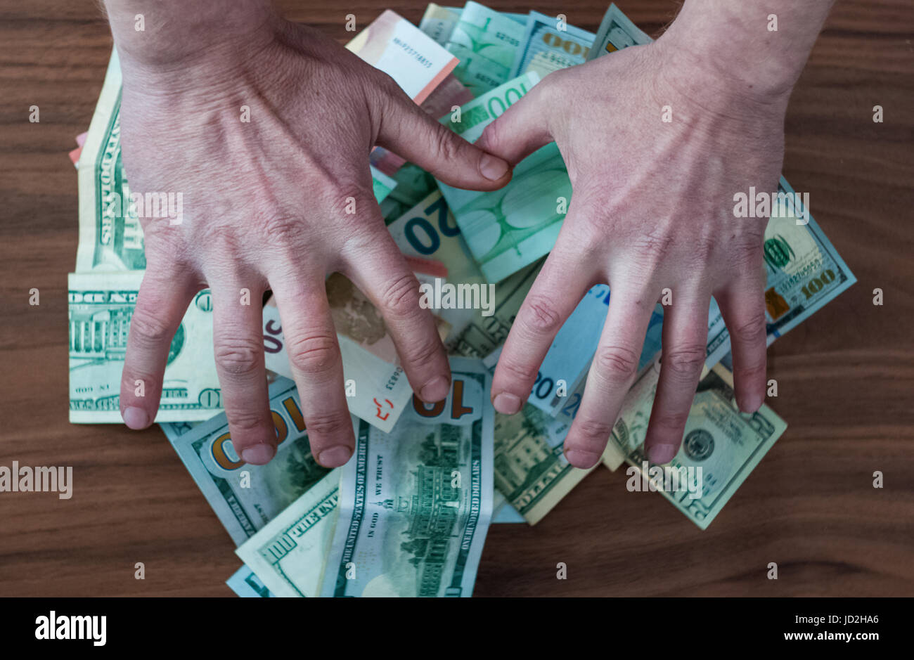 Paper money is scattered everywhere, and the hand of man they want to ...