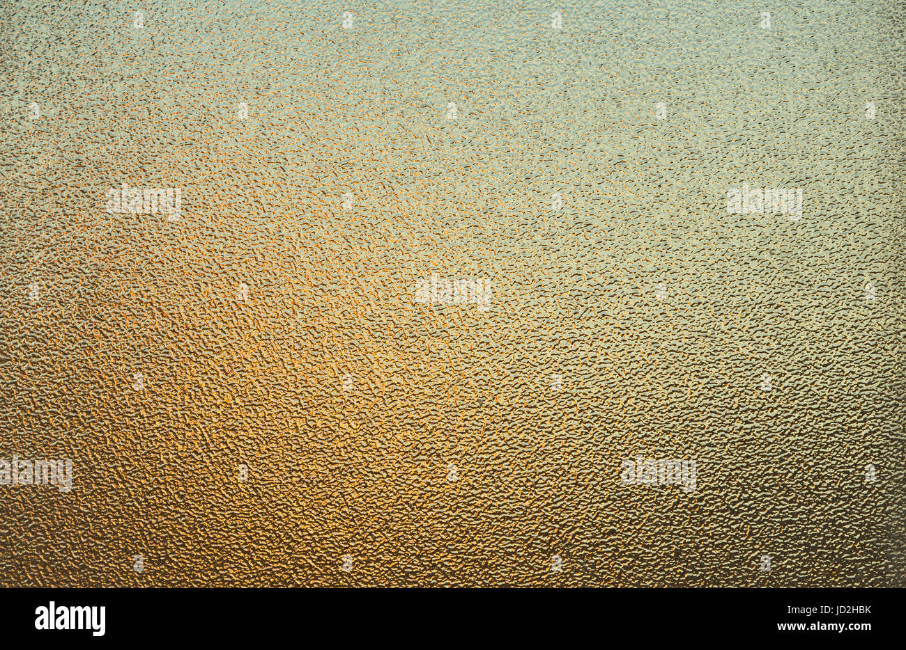 Warm golden looking ripple glass texture Stock Photo - Alamy