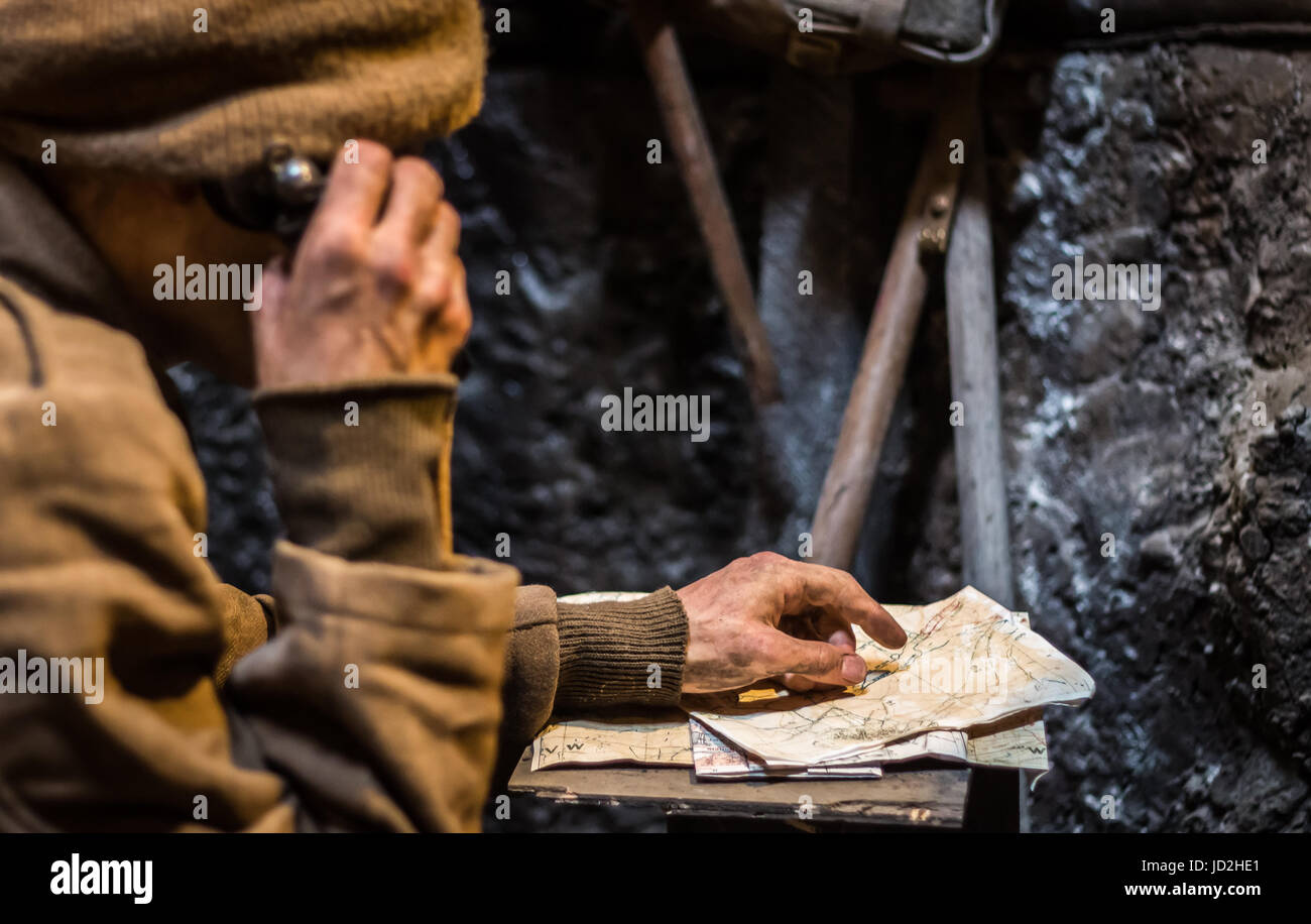 Soldier looking at his maps as he is talking on the phone Stock Photo ...