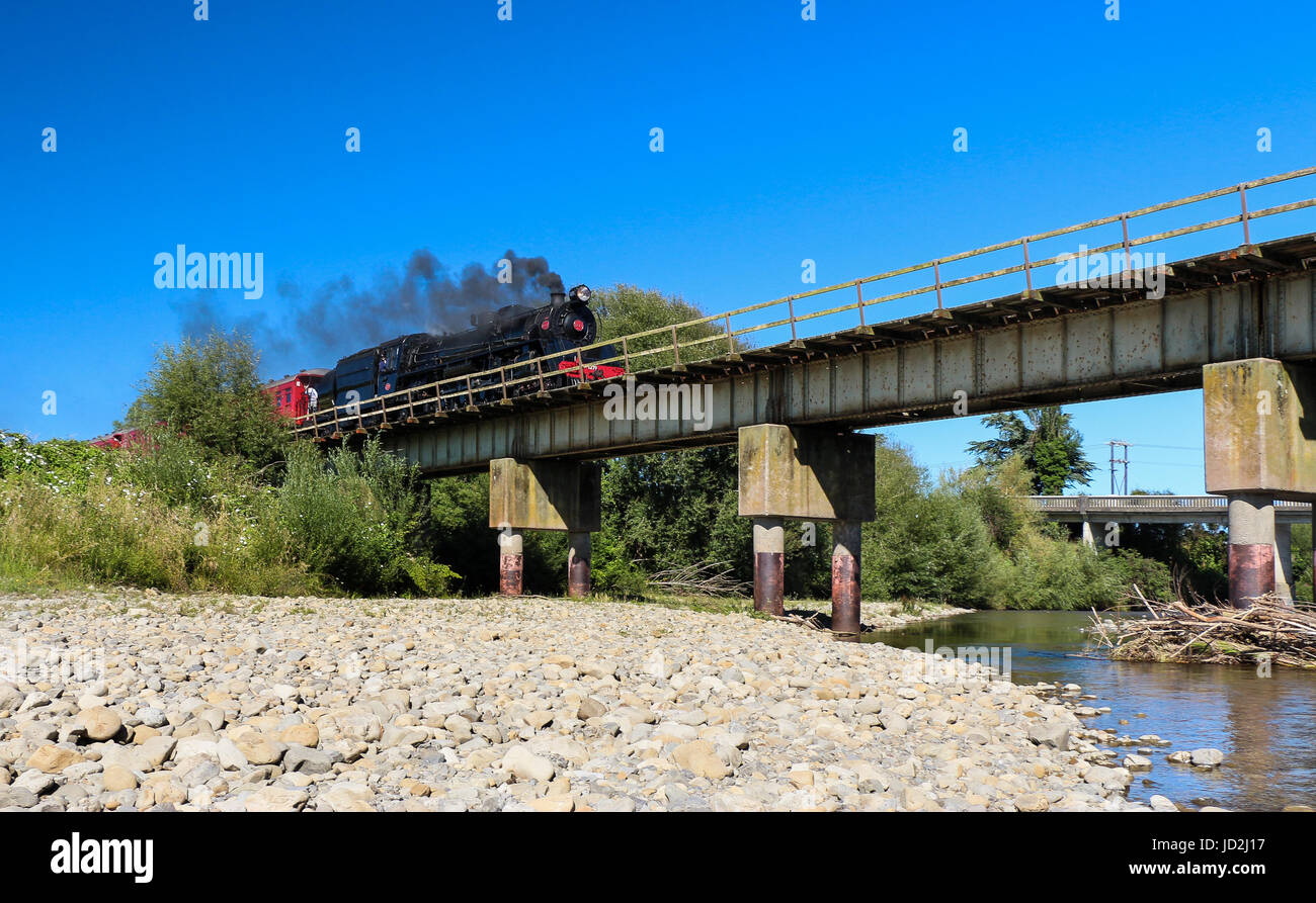 Steam train cross over a railway bridge Stock Photo - Alamy