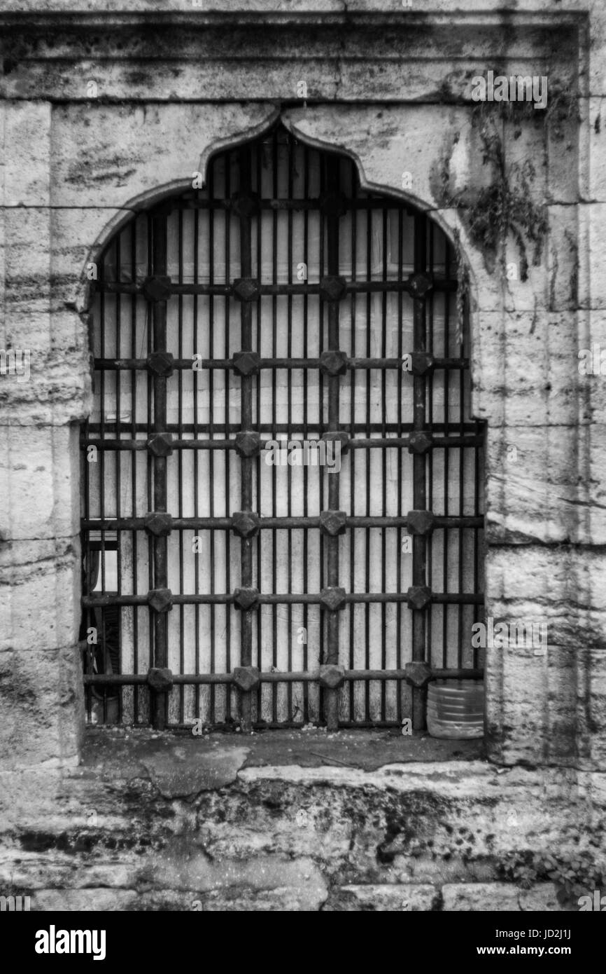 The old part of the fort with a window and old thick bars Stock Photo ...
