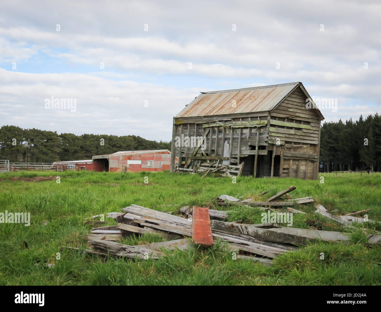 One very old but still standing farm house with old fencing in the ...