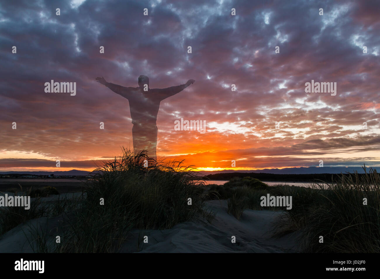 Man lifting his hands in worship to God The creator of sunrises Stock ...