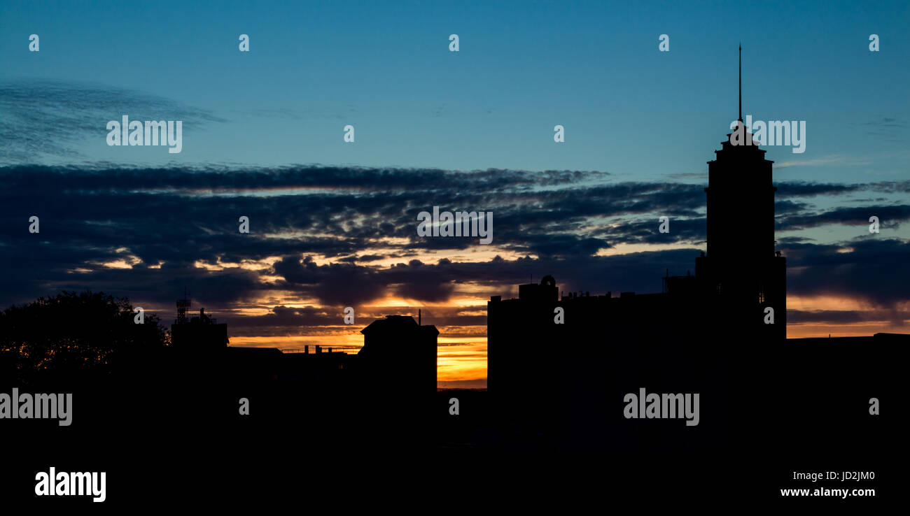 Sunset behind some City buildings Stock Photo - Alamy