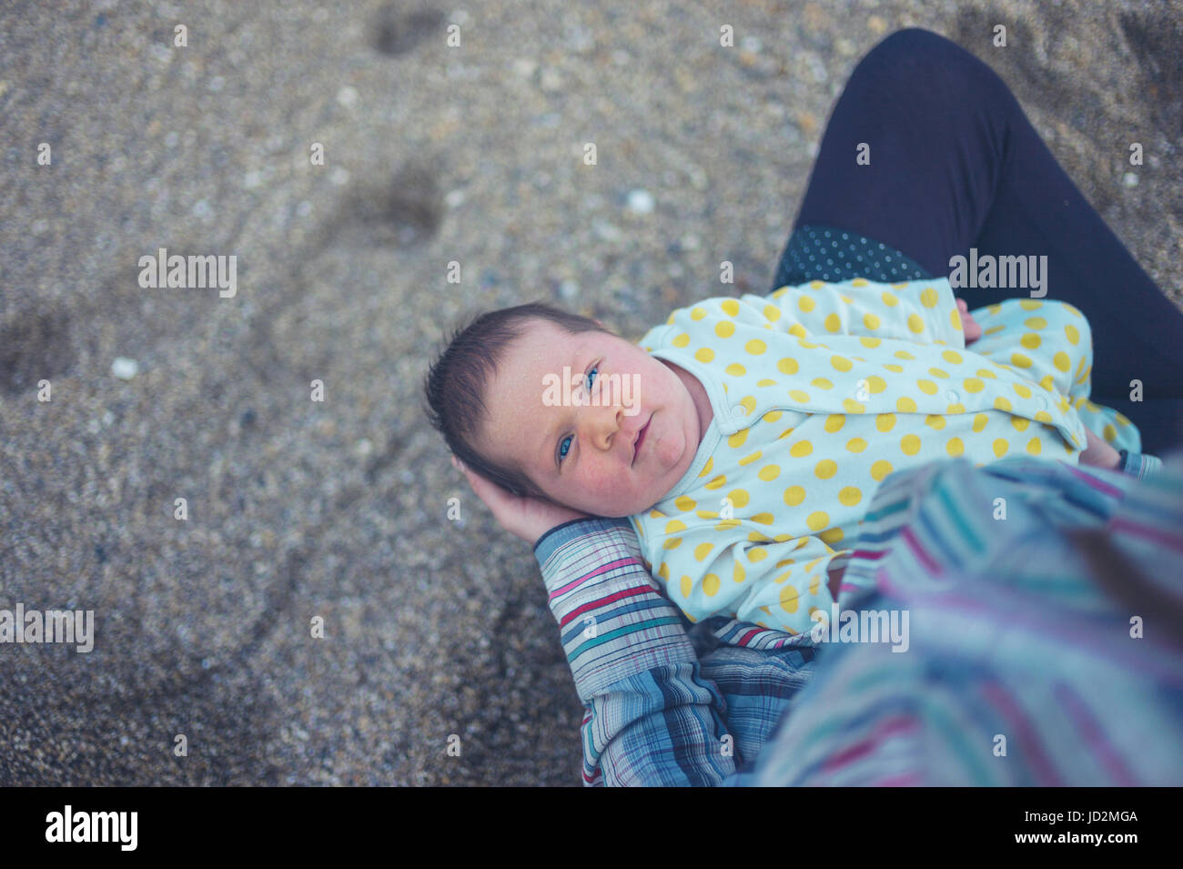 Child being held by parent hi-res stock photography and images - Alamy