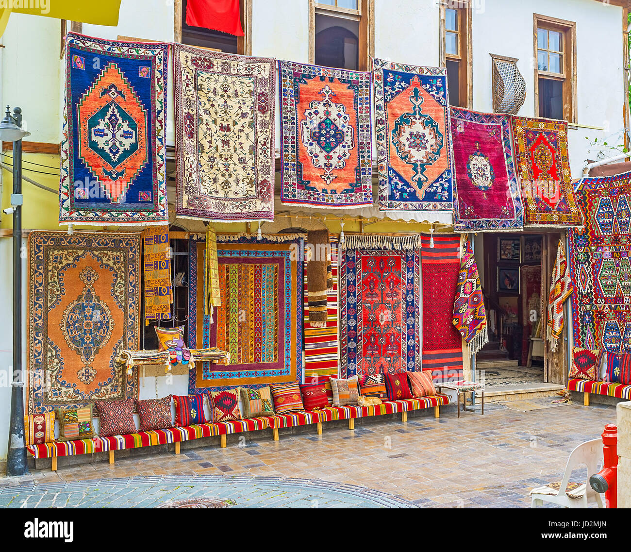 The facade of store decorated with various traditional silk, wool and ...