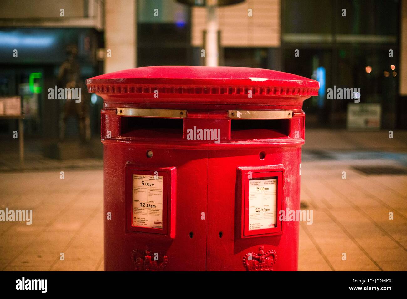 Photograph of a post box in the middle of the street at night Stock ...