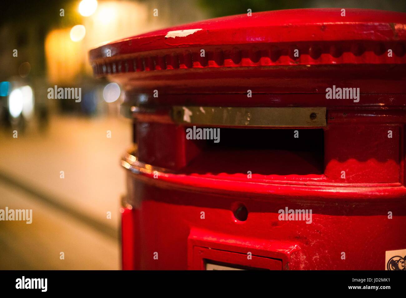 Photograph of a post box in the middle of the street at night Stock ...