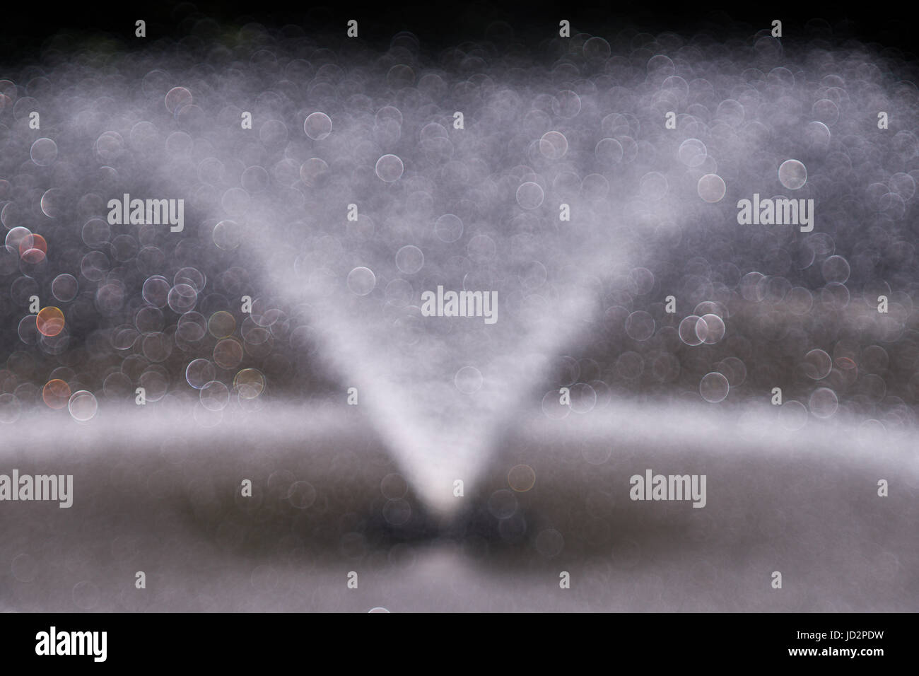 Water sprinkling from the fountain Stock Photo - Alamy