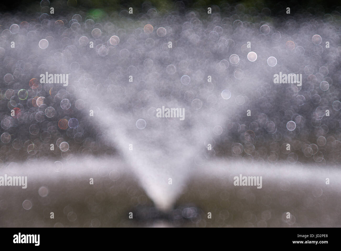 Water sprinkling from the fountain Stock Photo - Alamy