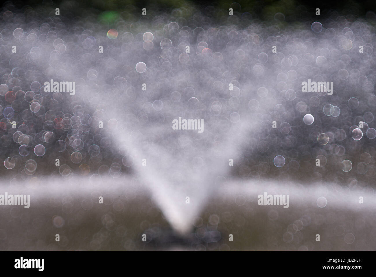 Water sprinkling from the fountain Stock Photo - Alamy