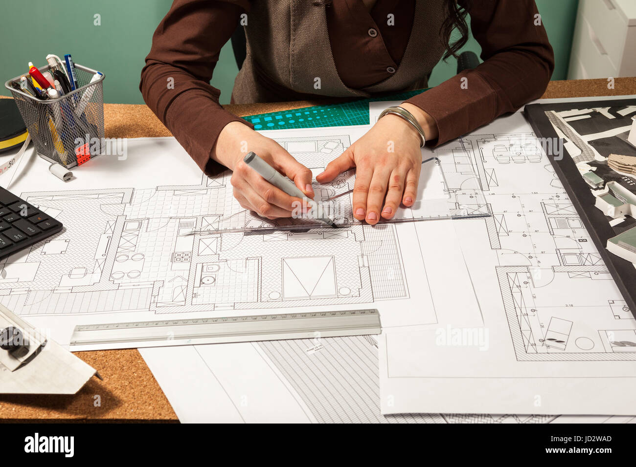 Close up of architect hands working on blueprints Stock Photo - Alamy