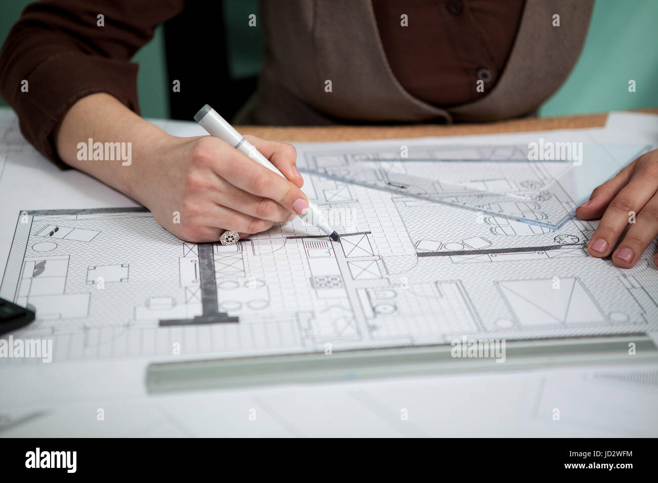 Close up of architect hands working on blueprints Stock Photo - Alamy