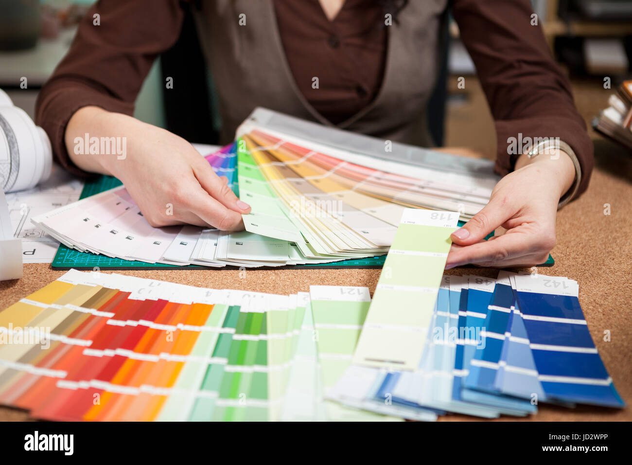 Close up of architect with color palette on her desk Stock Photo - Alamy
