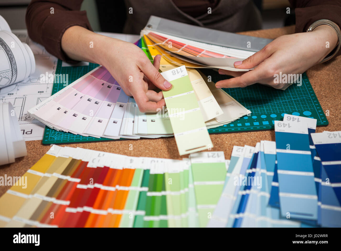 Close up of architect with color palette on her desk Stock Photo - Alamy