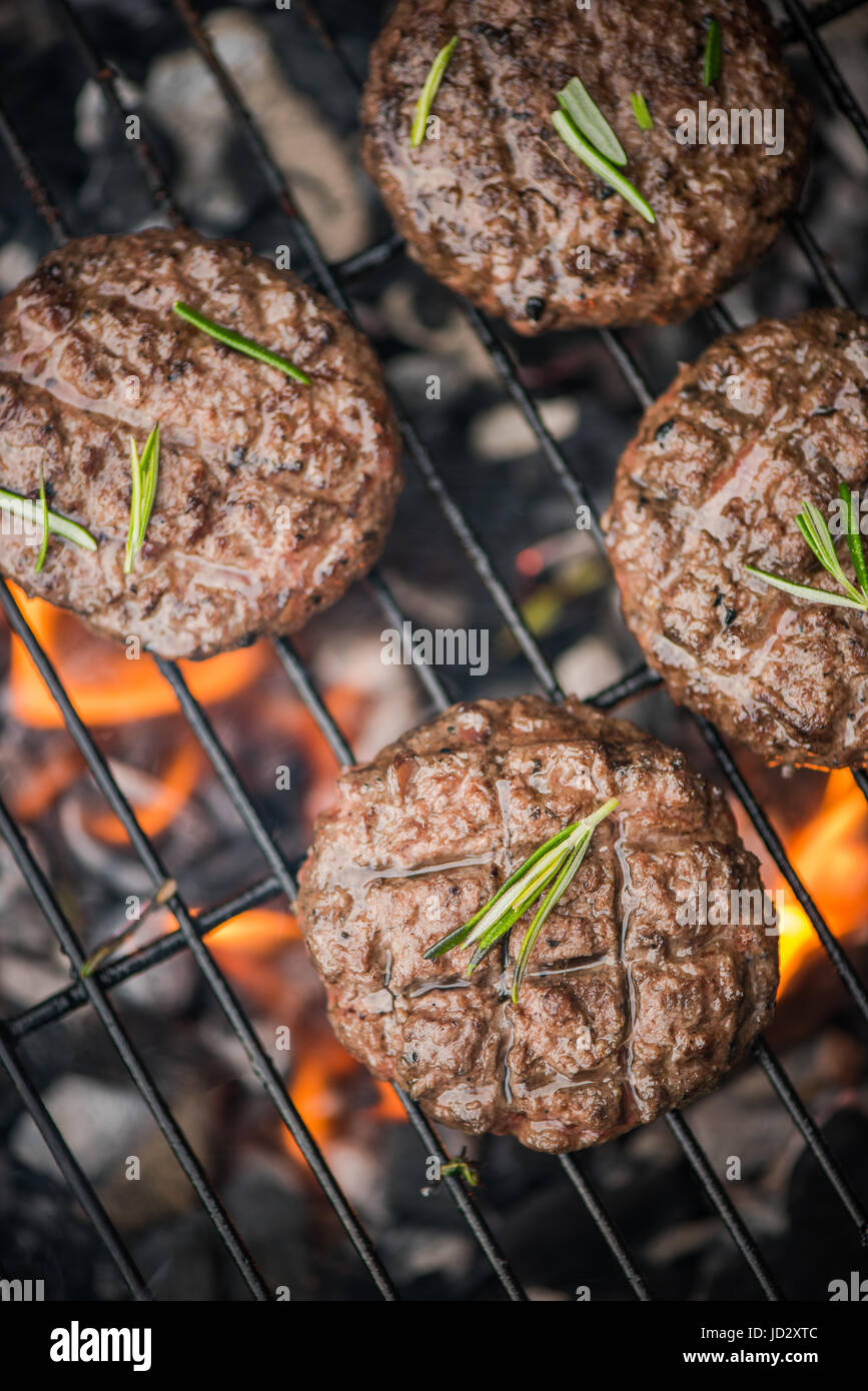 top view, beef burgers on bbq flames Stock Photo - Alamy