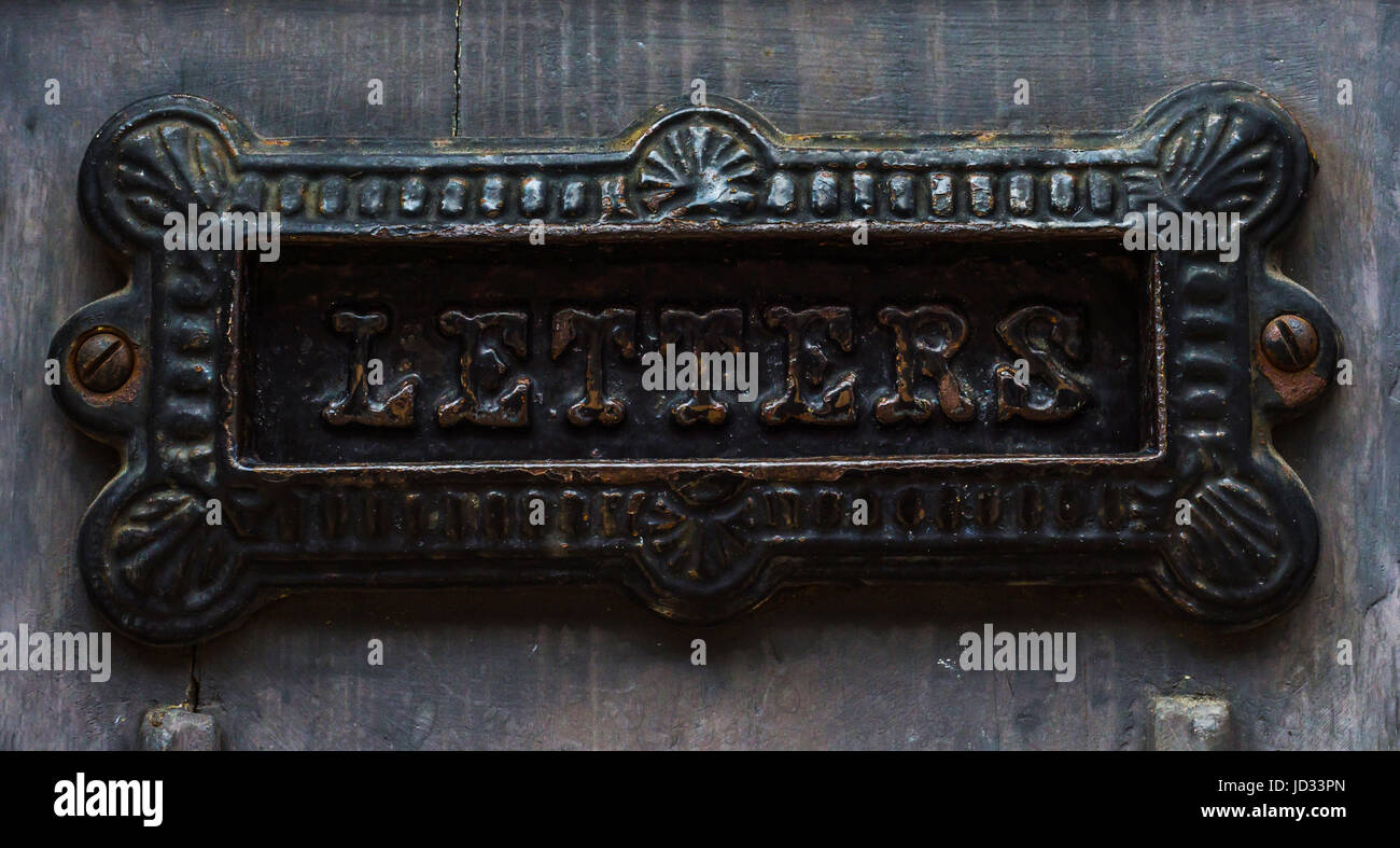 Old letterbox in the door, traditional way of delivering letters to the ...