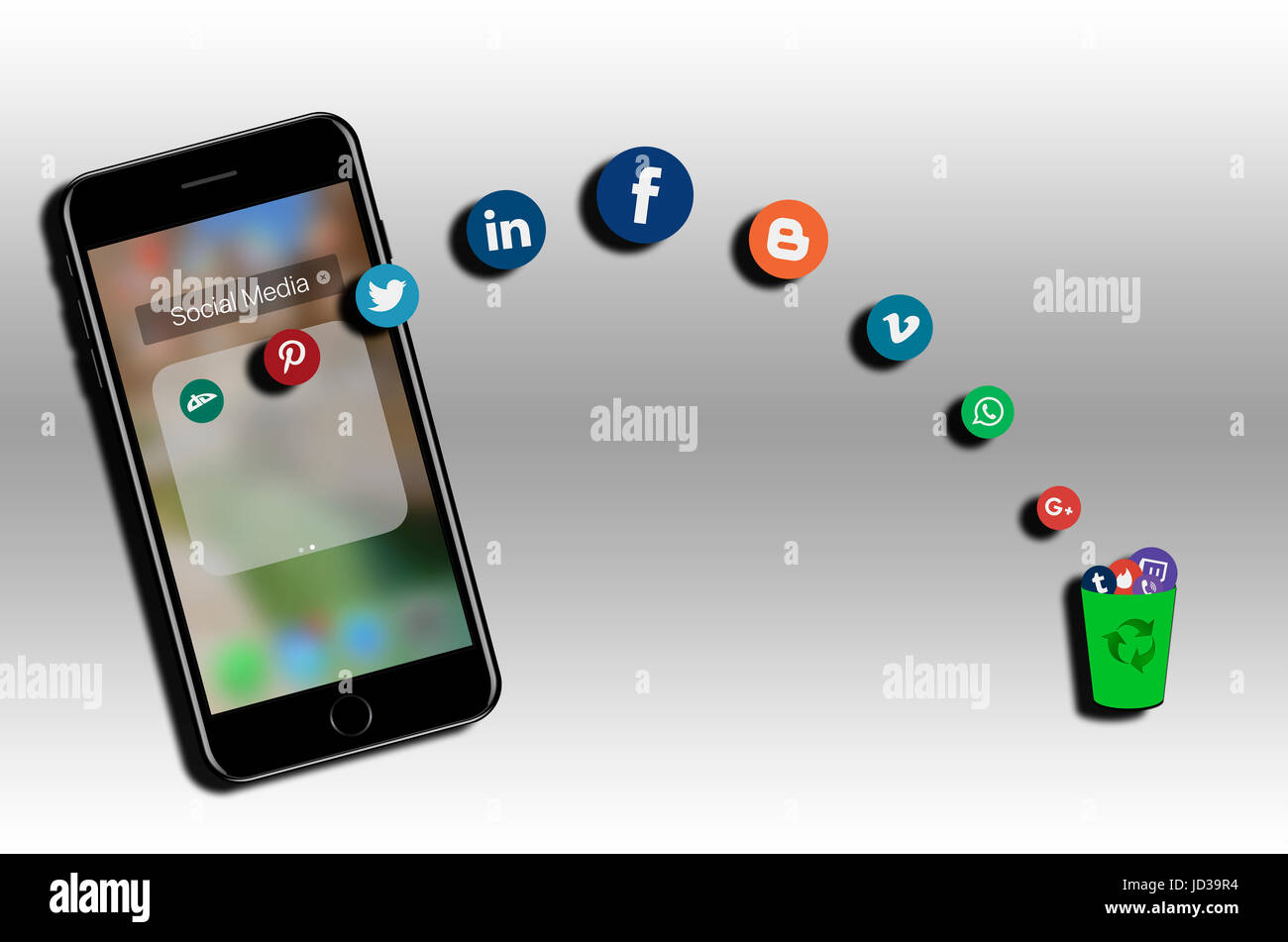 Social media apps falling into a green trash bin on a light grey ...