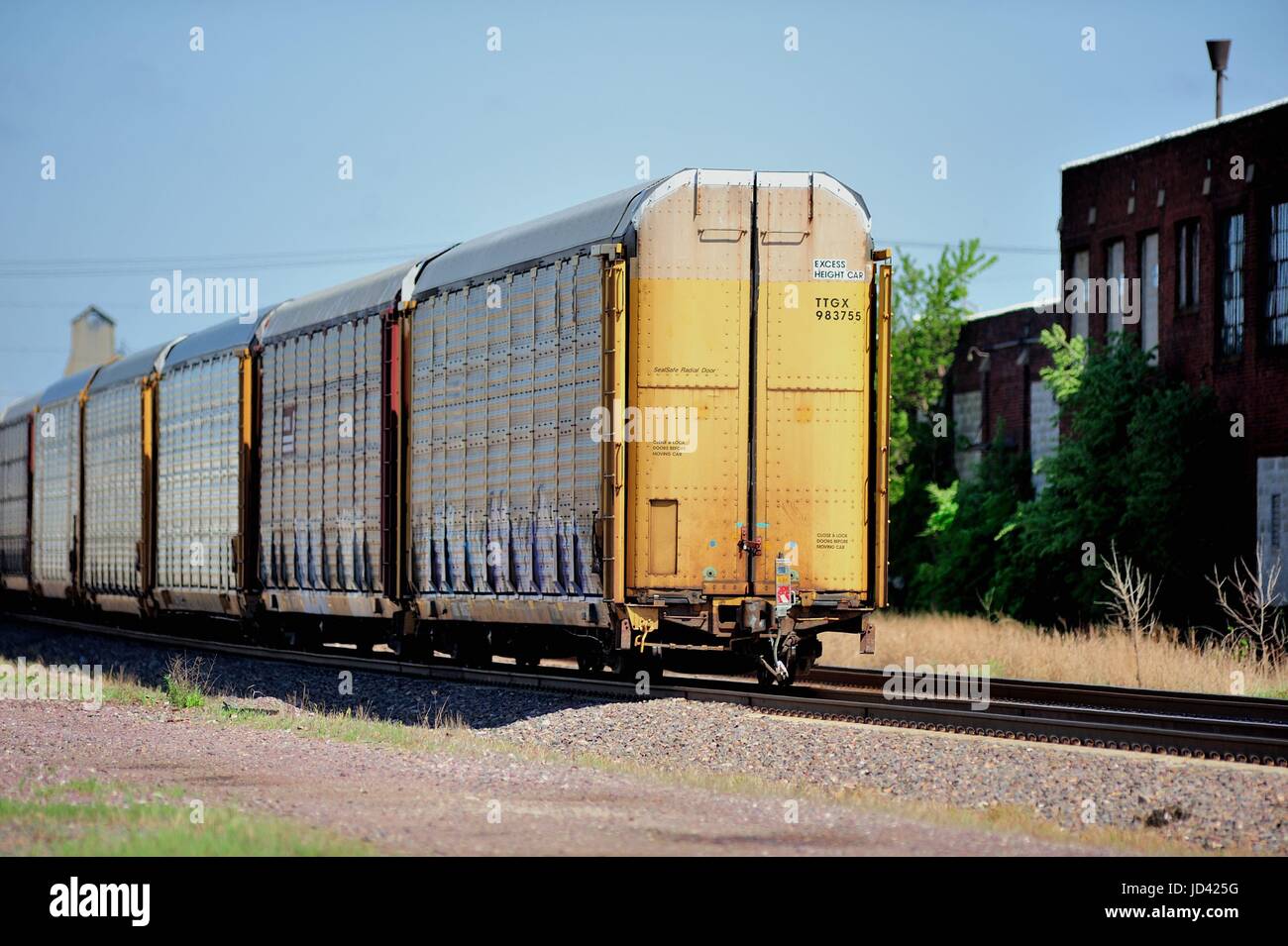 The rear end of an eastbound Union Pacific feight train with a heavy consist of freight as it ...