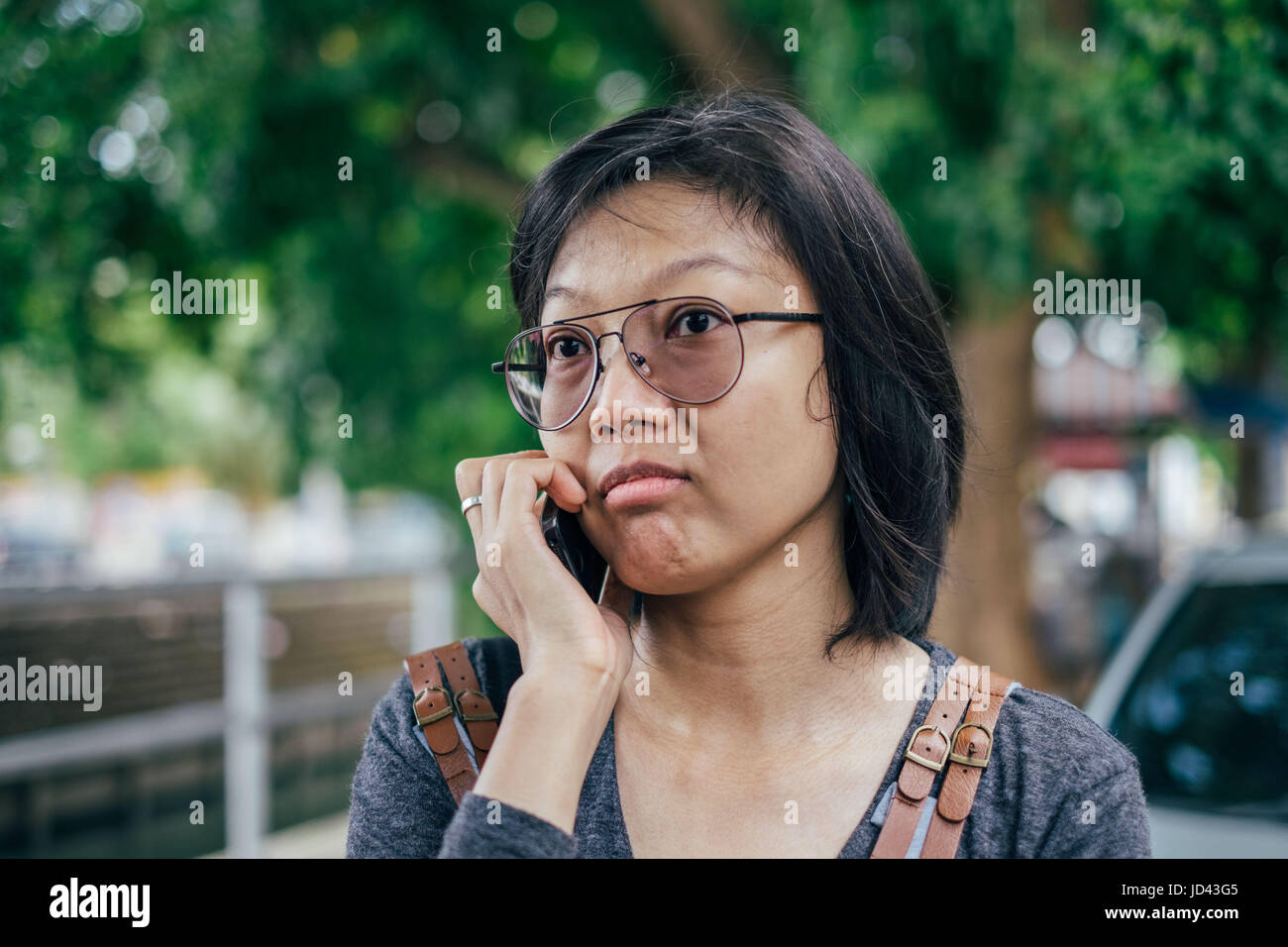 Woman calling with mobile phone disappointed on somethings Stock Photo ...