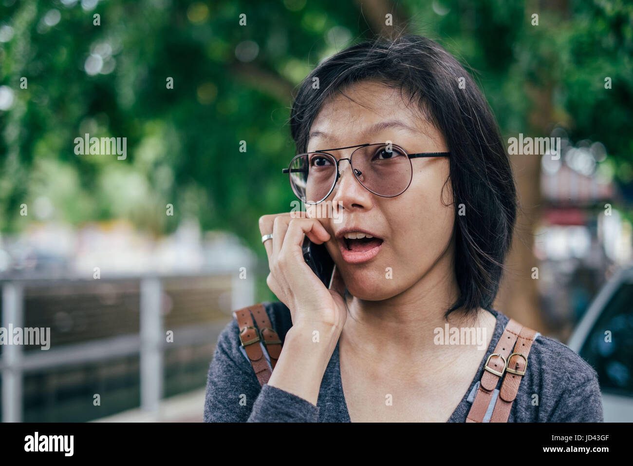 Woman calling with mobile phone disappointed on somethings Stock Photo ...