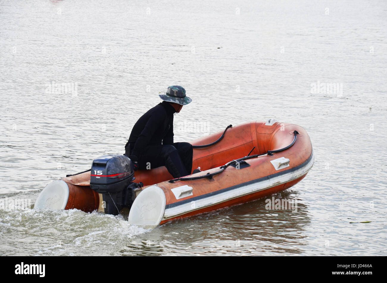 Security guard riding jet ski and rubber boat for safety and protection ...