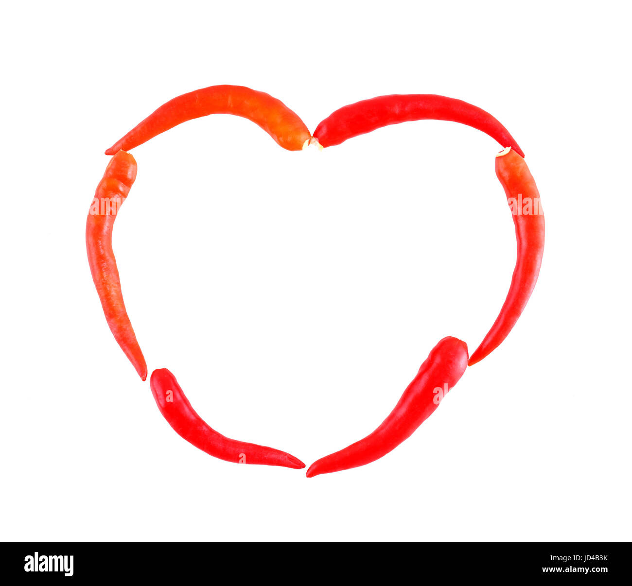 Red chili pepper heart shape isolated Stock Photo - Alamy