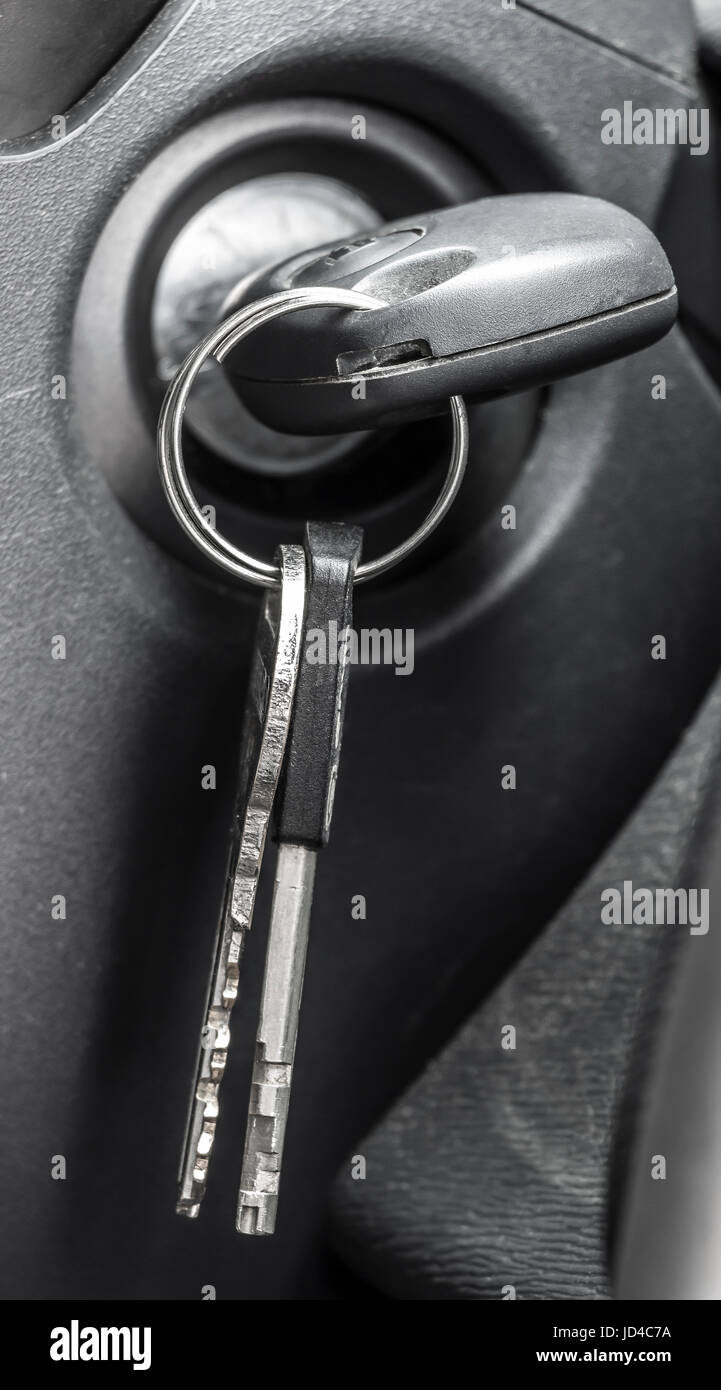 Keys in the ignition lock closeup Stock Photo - Alamy