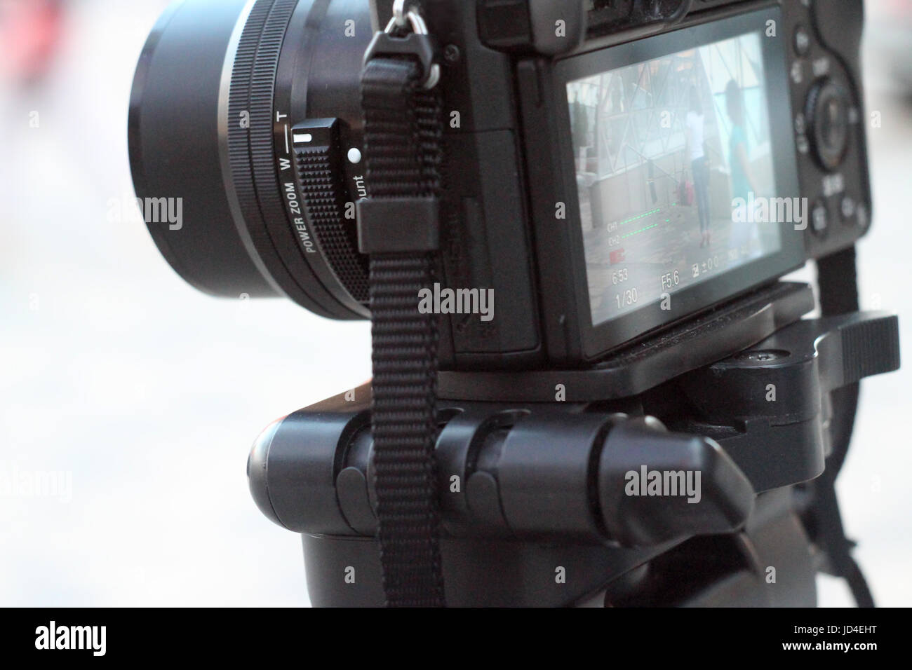 The digital video camera on the tripod Stock Photo - Alamy