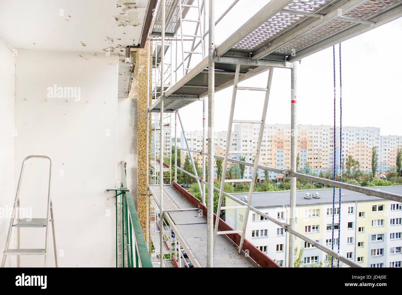 Scaffolding set on a skyscraper. A building built of large concrete ...