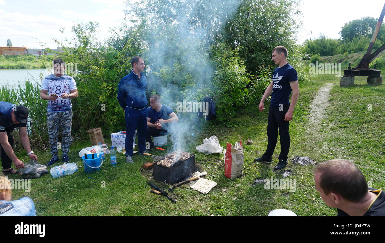 Kursk, Russia - June1, 2017: Group of friends having pic-nic in a park ...