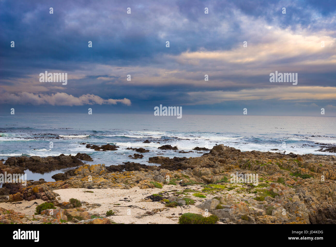 Rocky coast line on the ocean at De Kelders, South Africa, famous for whale watching. Winter ...