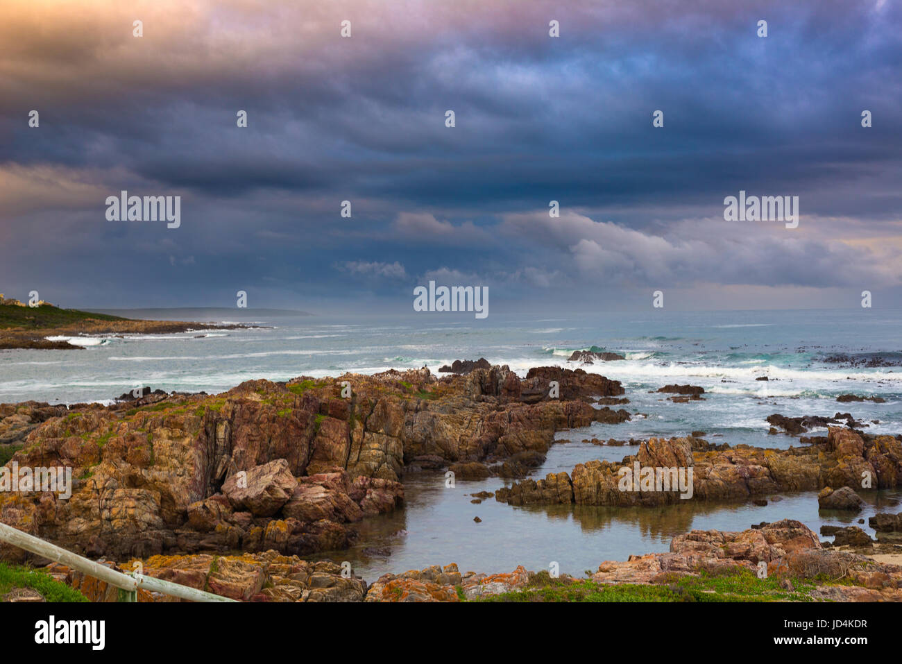 Rocky coast line on the ocean at De Kelders, South Africa, famous for whale watching. Winter ...