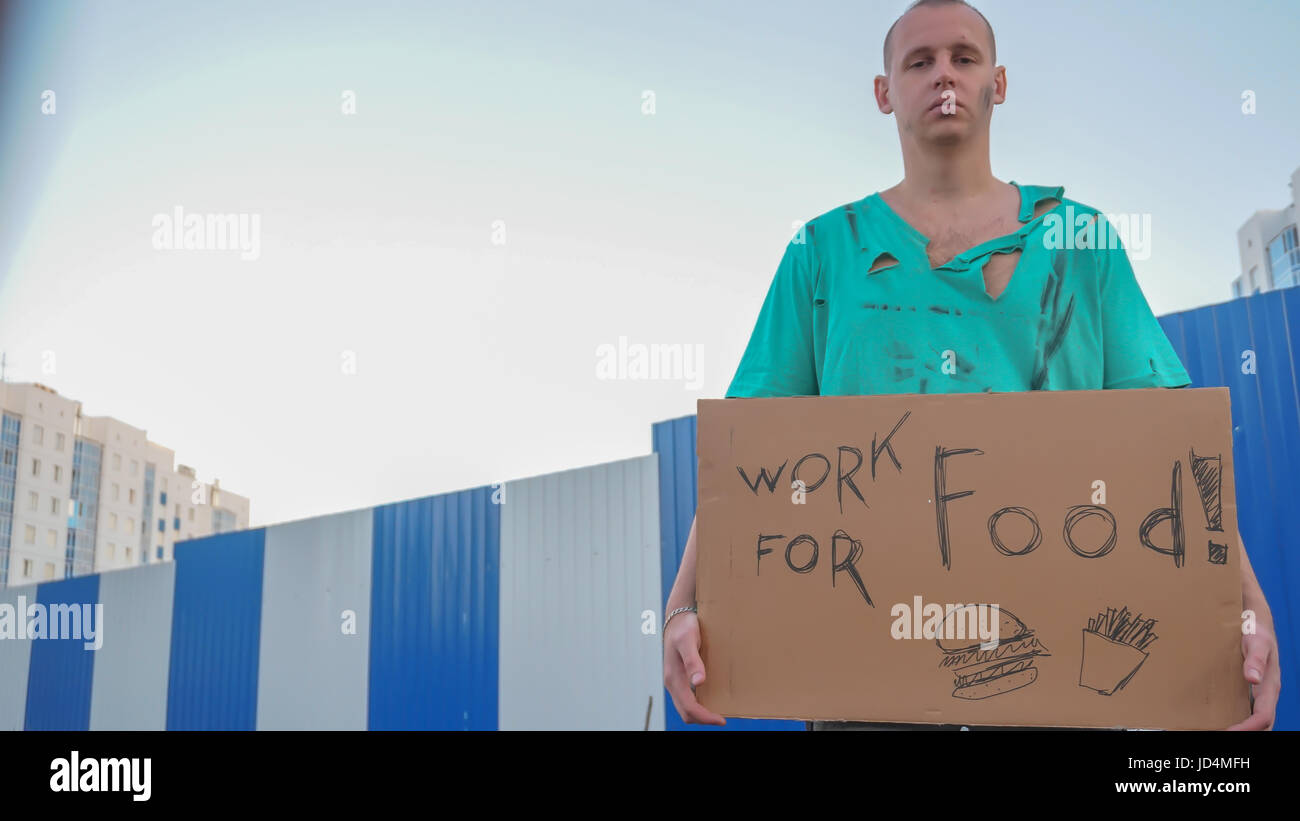 homeless with a sign in hand : work for food Stock Photo - Alamy
