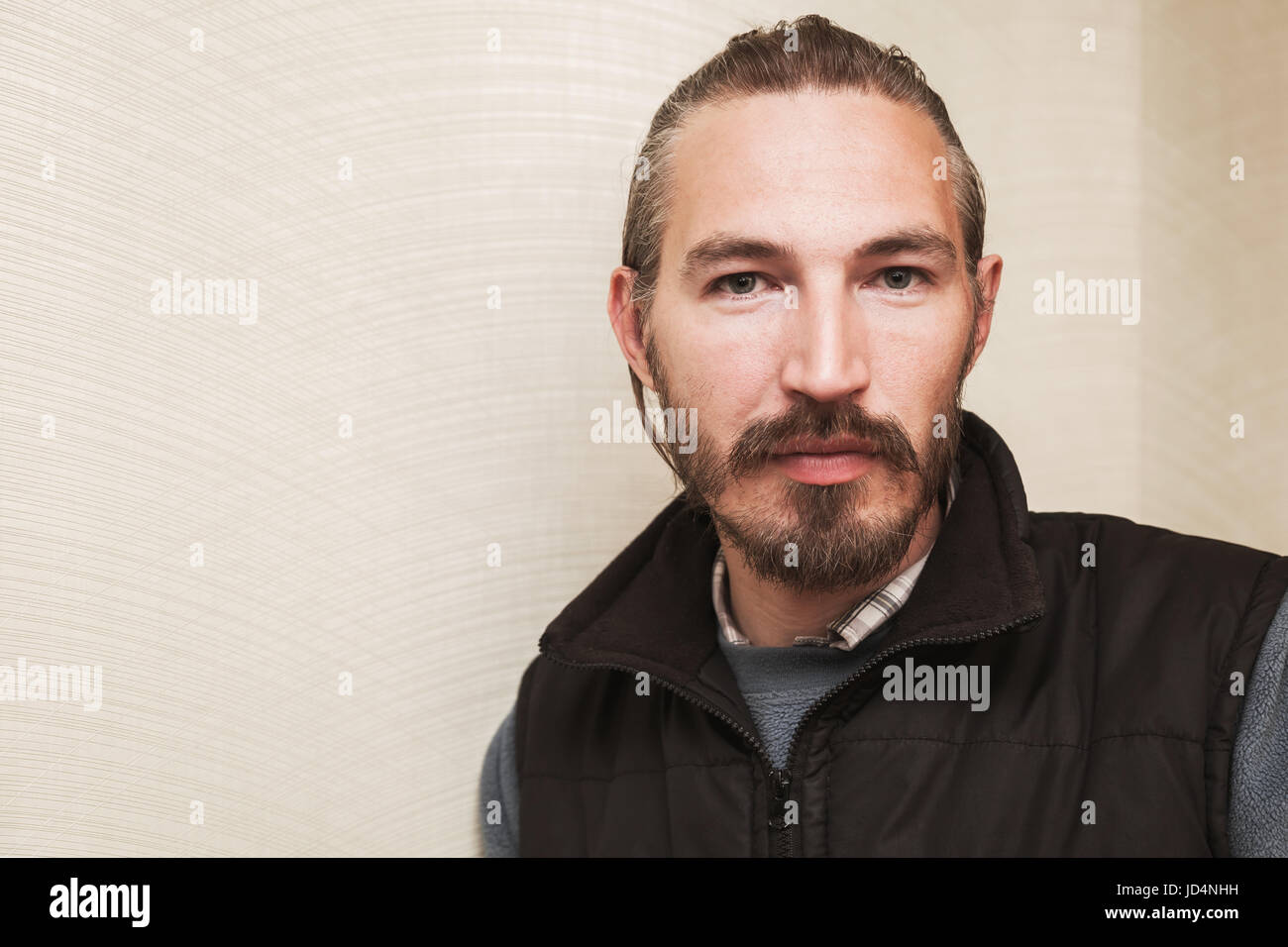 Close up studio portrait of young bearded Asian man Stock Photo - Alamy