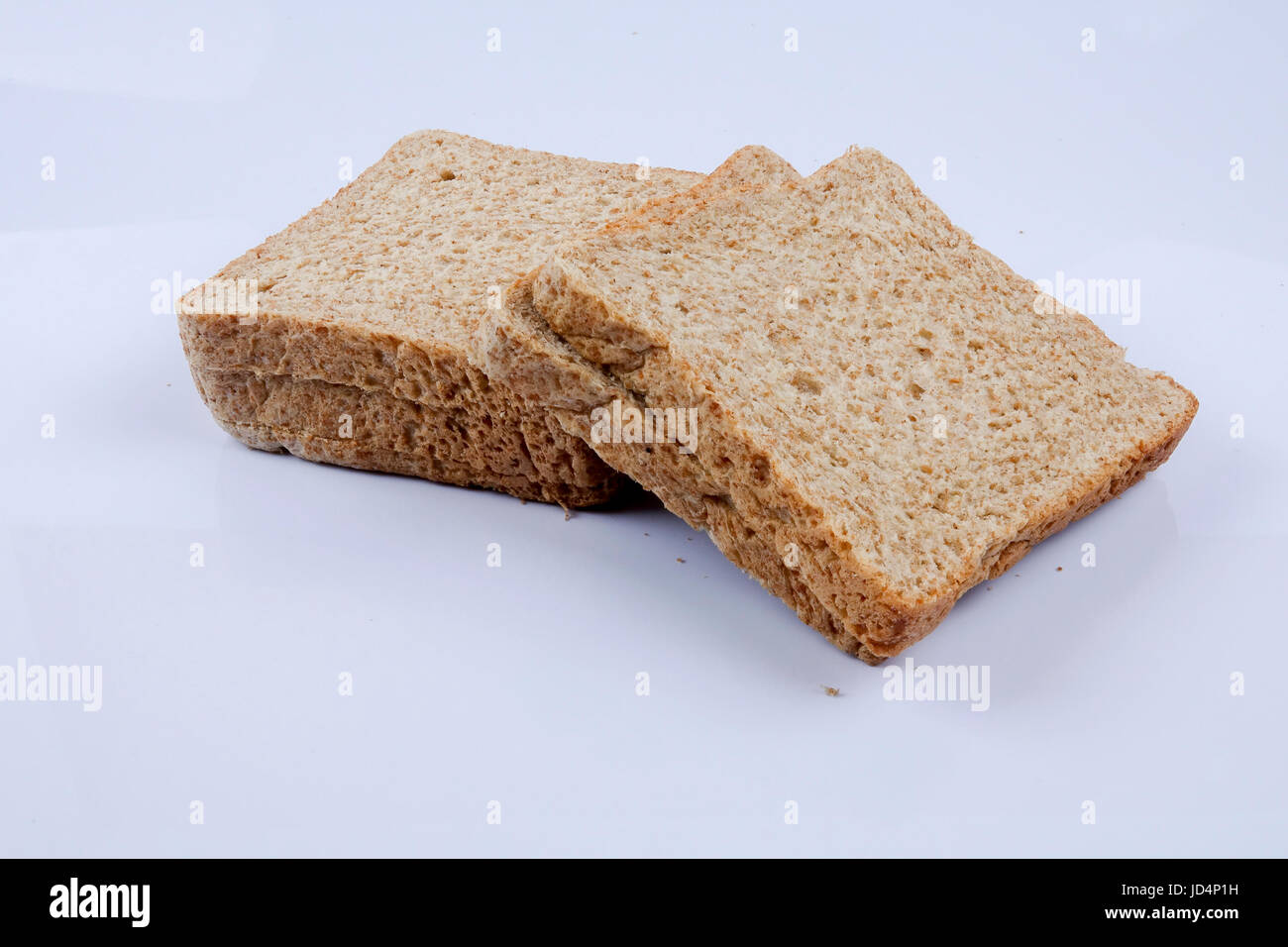 Loaf of wholemeal bread on white background Stock Photo - Alamy