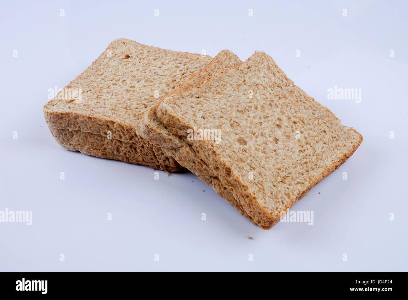Loaf of wholemeal bread on white background Stock Photo - Alamy
