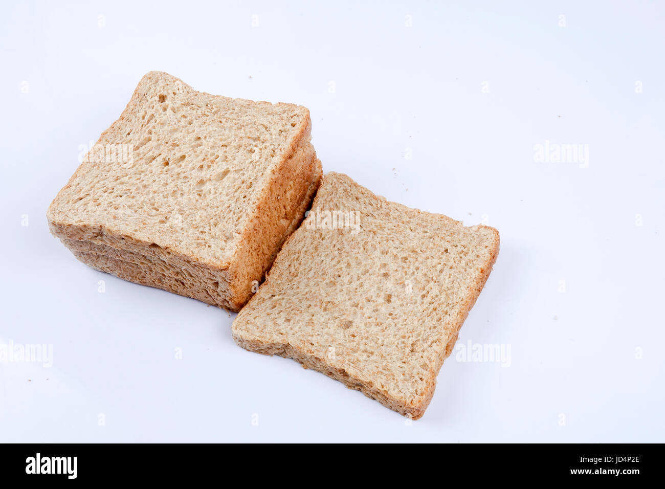 Loaf of wholemeal bread on white background Stock Photo - Alamy