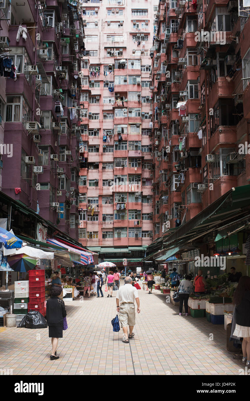 Market for locals in between High rise buildings with ground level ...