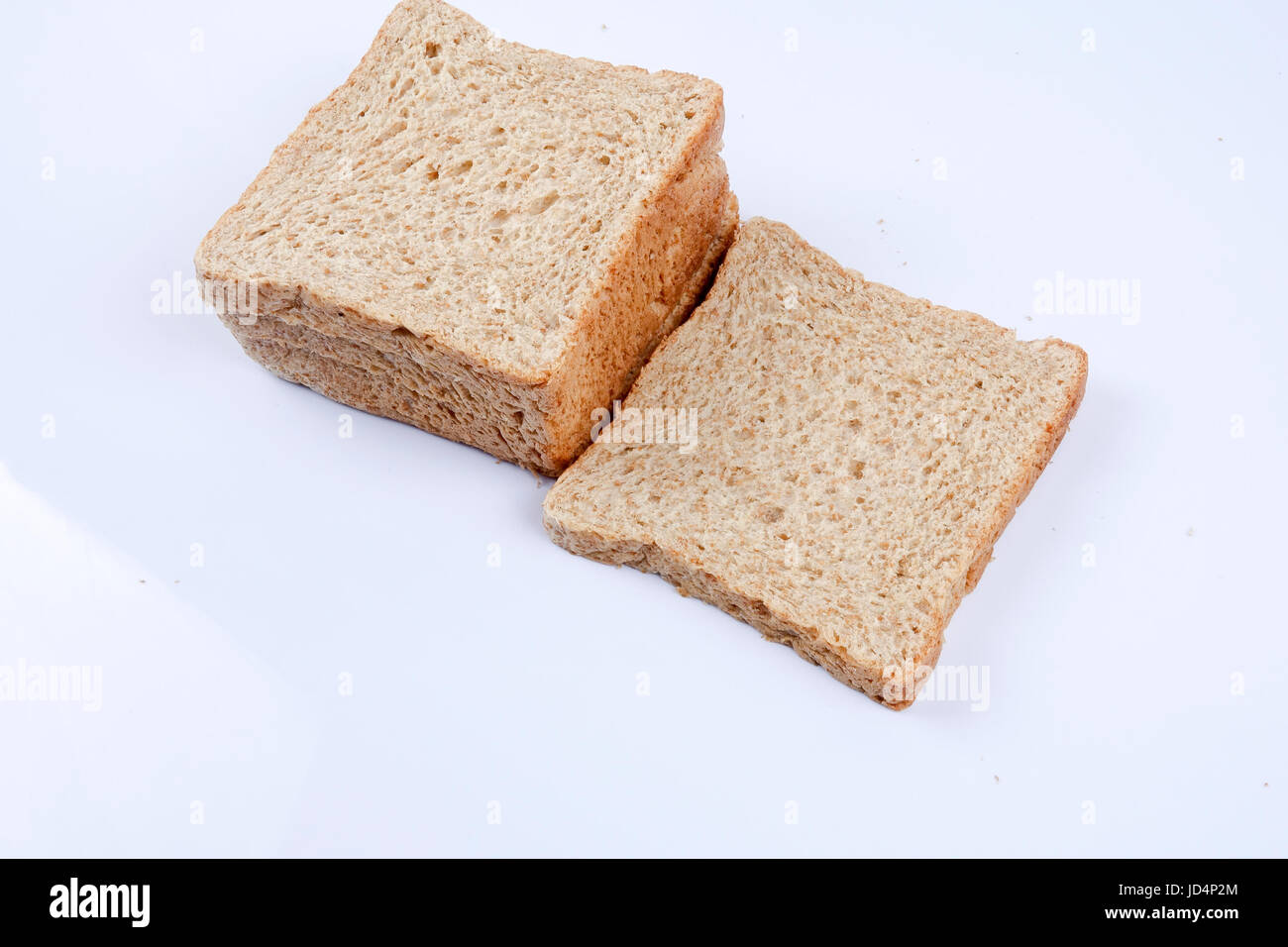 Loaf of wholemeal bread on white background Stock Photo - Alamy