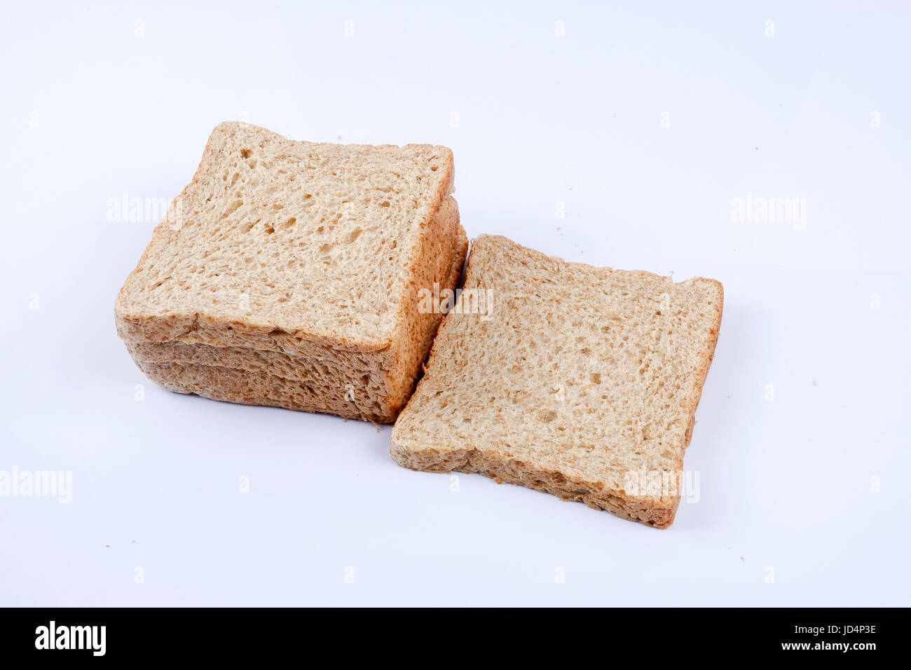 Loaf of wholemeal bread on white background Stock Photo - Alamy