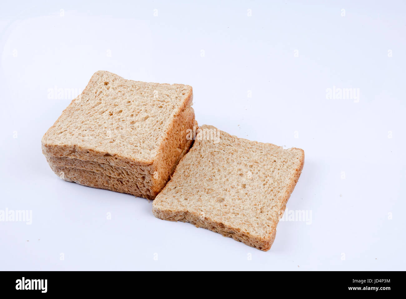 Loaf of wholemeal bread on white background Stock Photo - Alamy