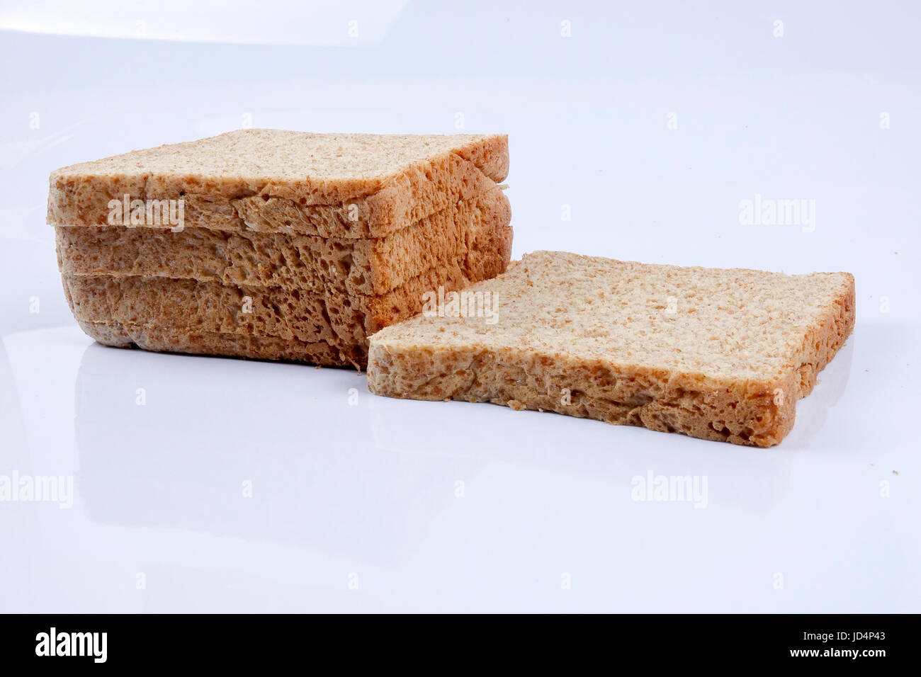Loaf of wholemeal bread on white background Stock Photo - Alamy