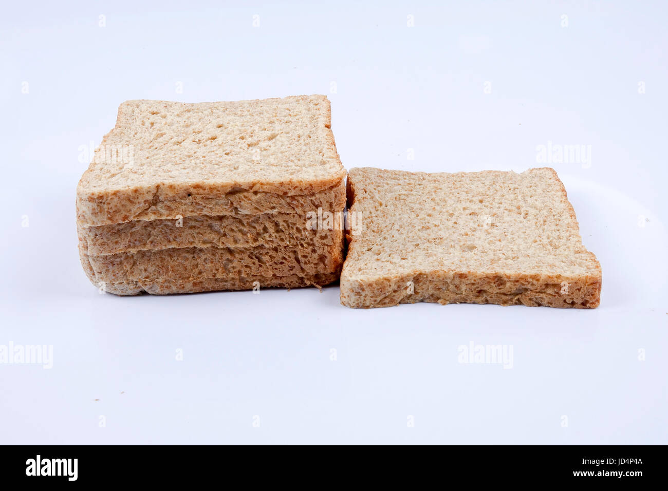 Loaf of wholemeal bread on white background Stock Photo - Alamy