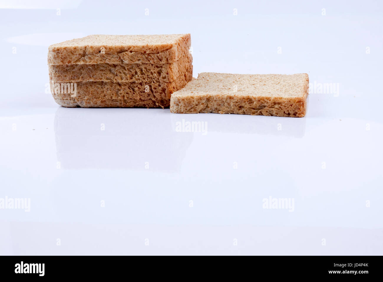 Loaf of wholemeal bread on white background Stock Photo - Alamy