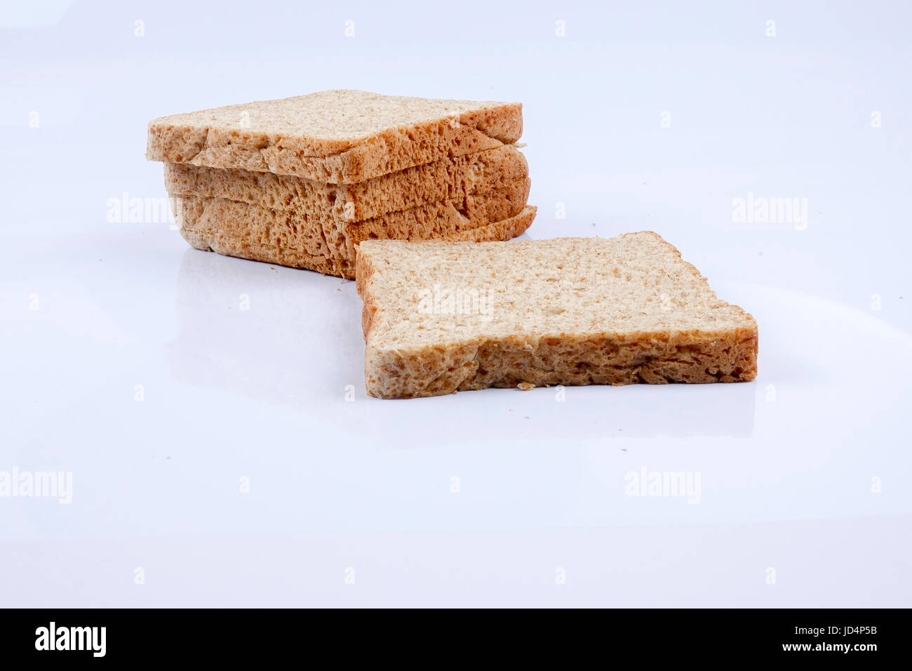 Loaf of wholemeal bread on white background Stock Photo - Alamy